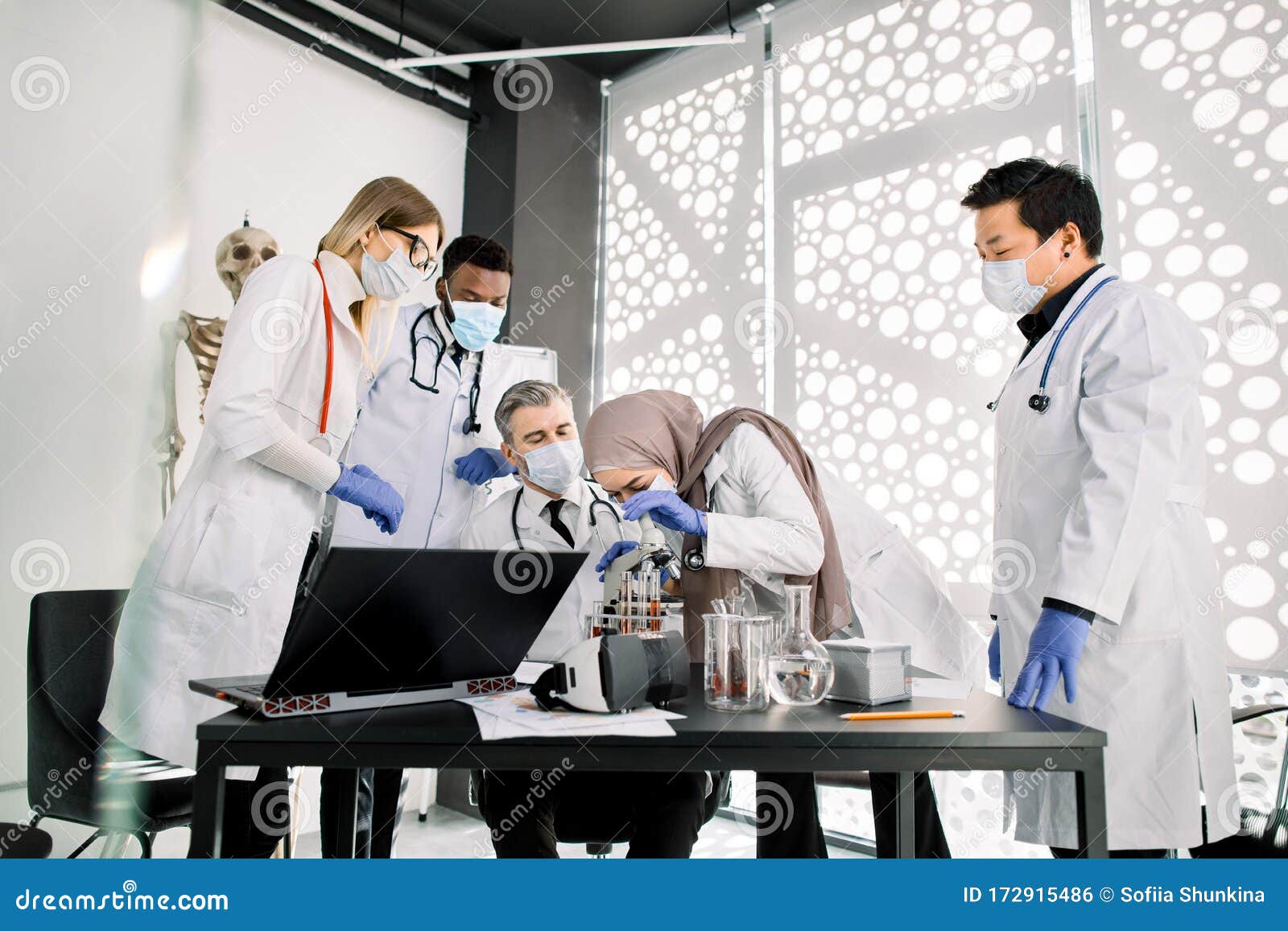 Team of Scientists Doctors Biochemists Working with Microscope, Doing ...