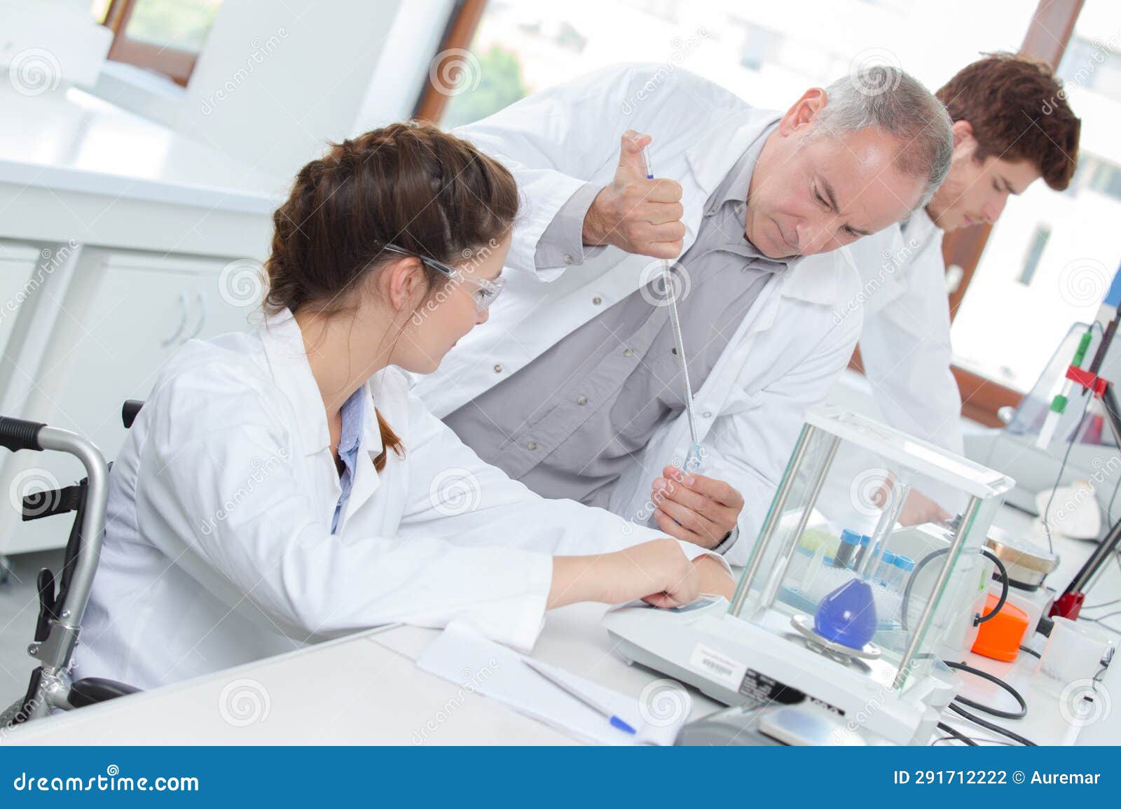 Team Scientists in Laboratory Working on Chemical Testing Stock Photo ...