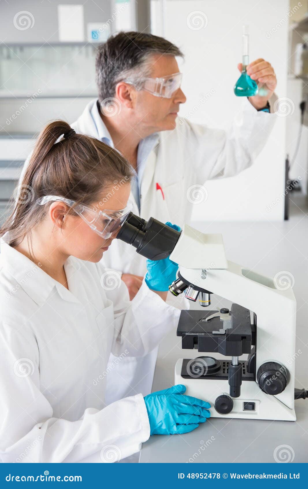 Team of scientists at work stock photo. Image of scientis - 48952478
