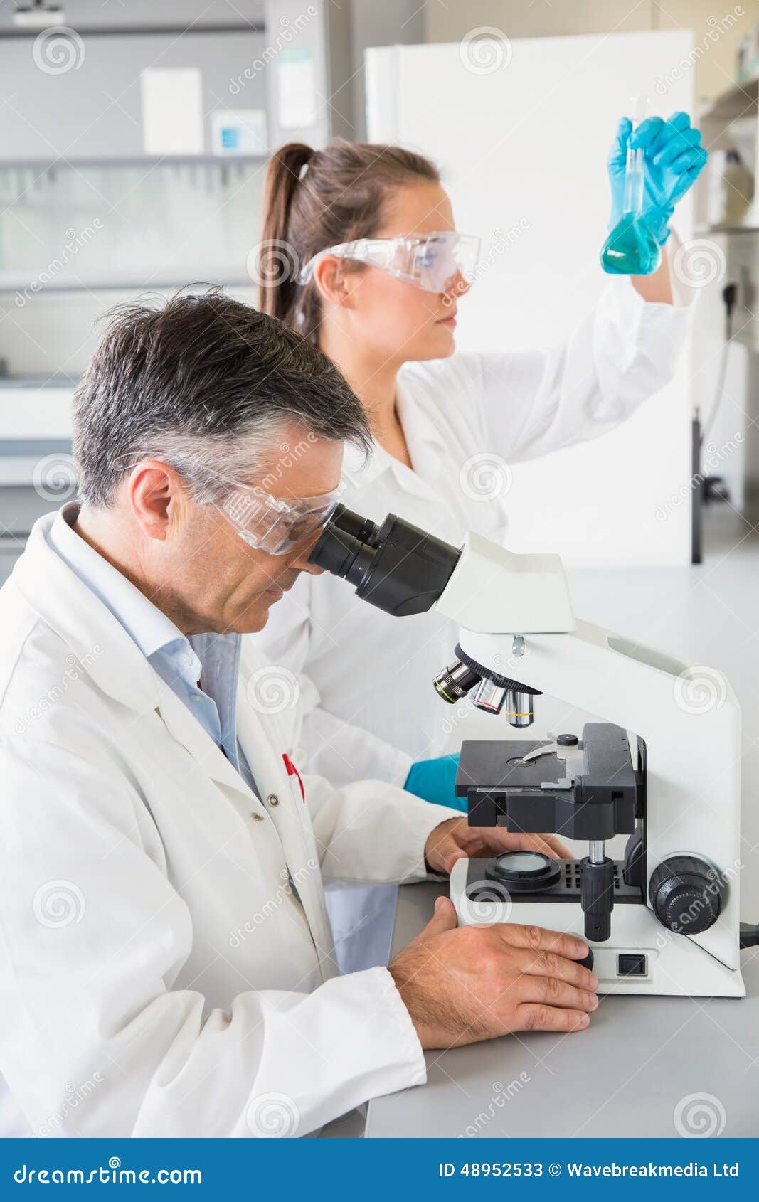 Team of scientists at work stock image. Image of adult - 48952533