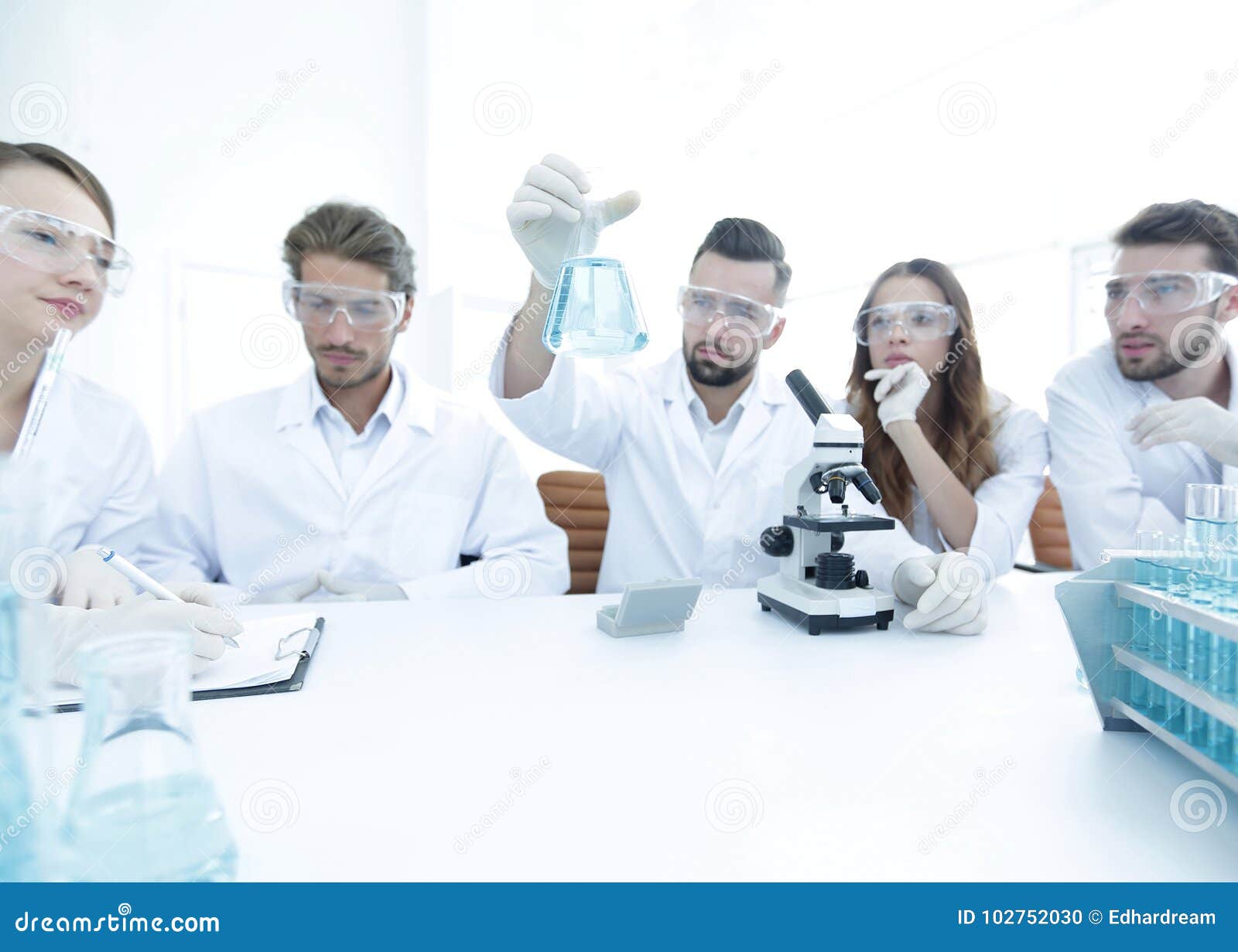 Team of Scientists Working Together at the Laboratory Stock Photo ... Team of Scientists Working Together at the Laboratory Stock Photo ...