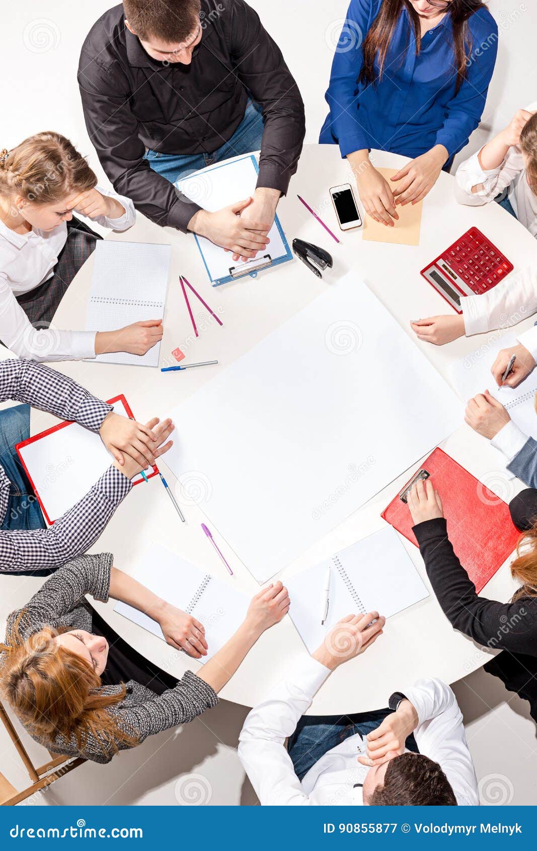 Team Sitting Behind Desk, Checking Reports, Talking. Top View Stock ...