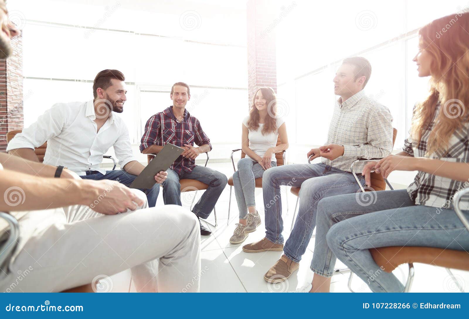 Team Sitting in a Lesson on Team Building Stock Photo - Image of female ...