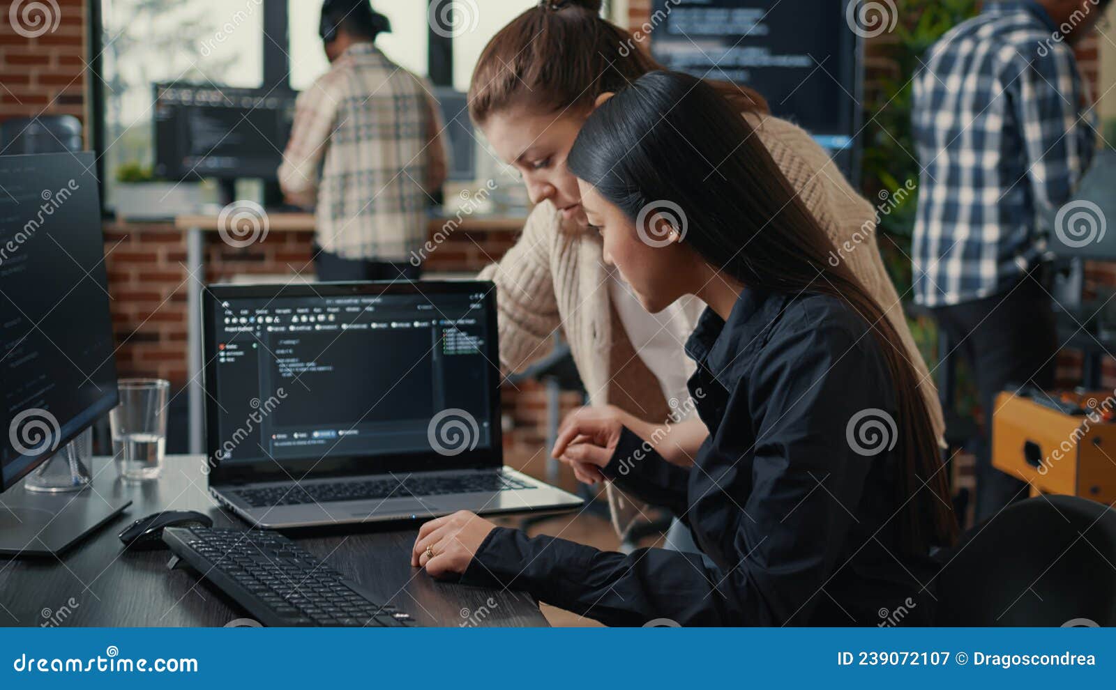 Team of Software Developers Talking about Source Code Running on Laptop ...