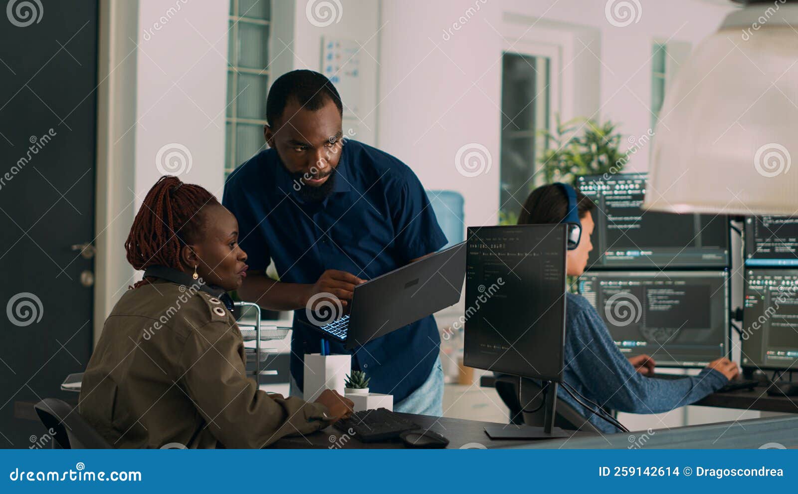 Team of Software Developers Talking about Source Code Running on Laptop ...