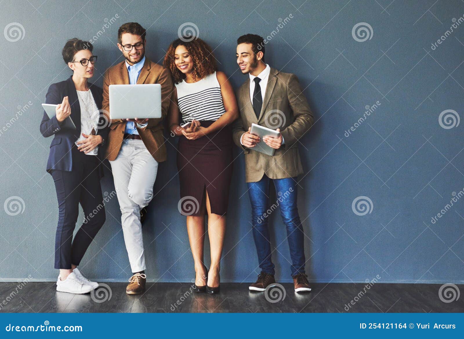 The Team that Stays Connected. Studio Shot of a Group of Businesspeople ...