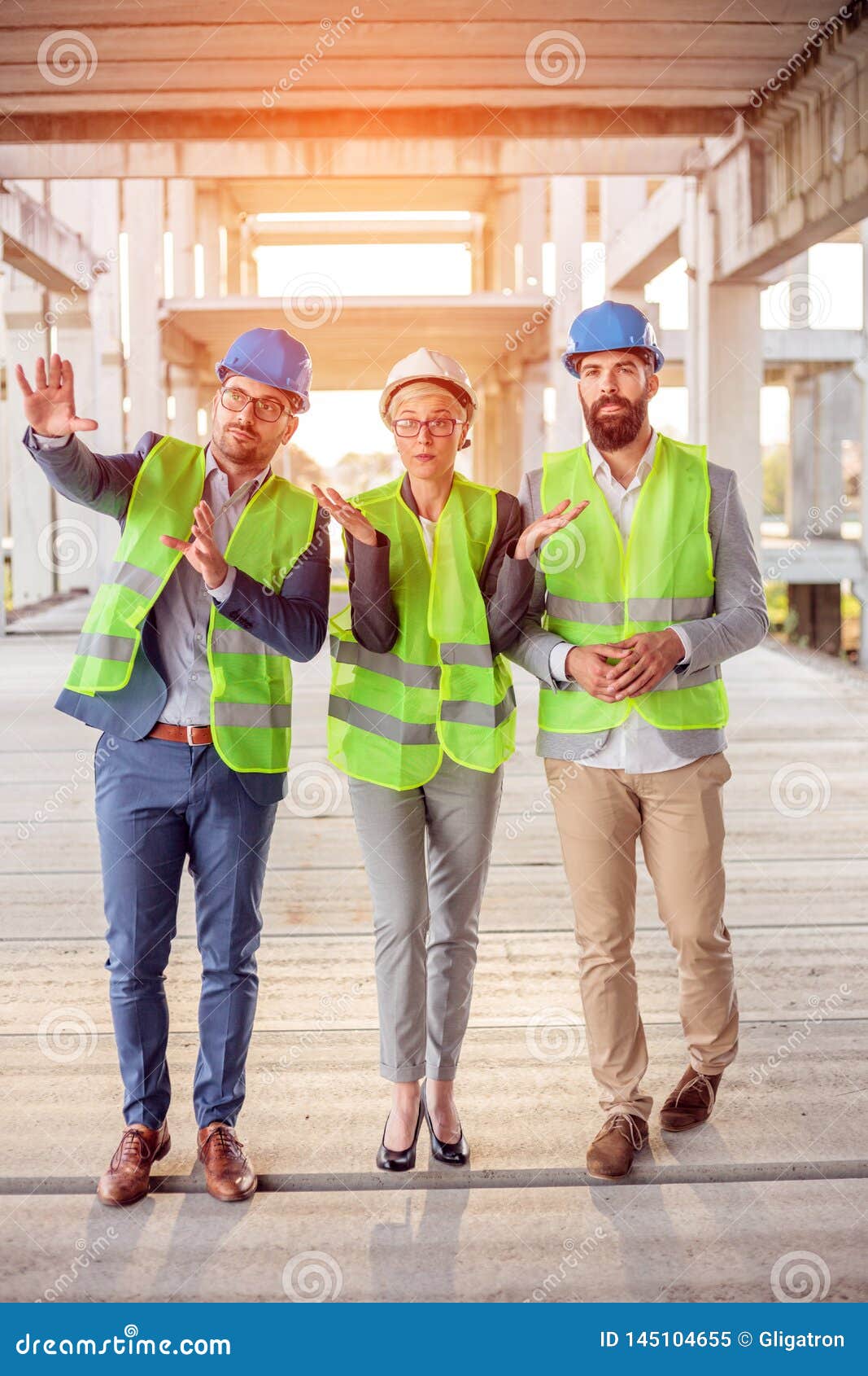Mixed Group of Architects Walking through Prefabricated Concrete ...