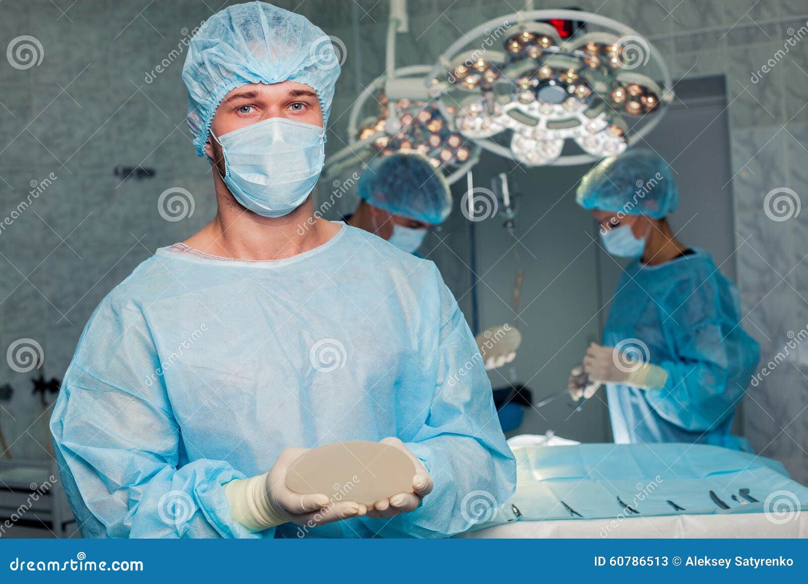 Team Surgeon At Work In Operating Room. Surgical Light In The Operating ...