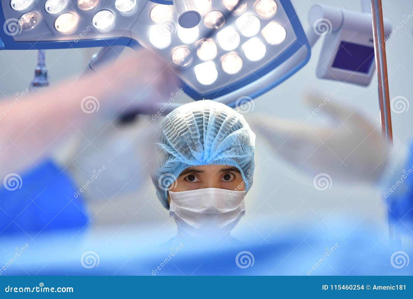 Team Surgeon At Work In Operating Room. Surgical Light In The Operating ...
