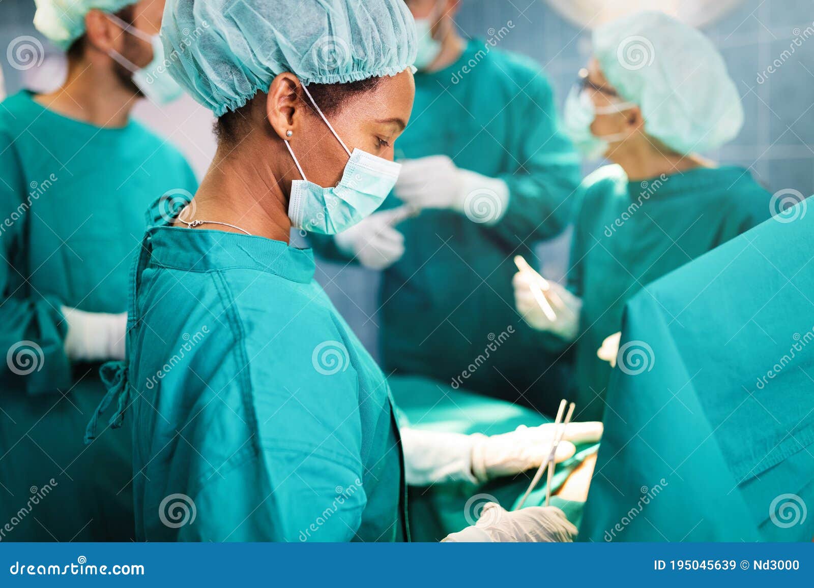 Team Surgeon At Work In Operating Room. Surgical Light In The Operating ...