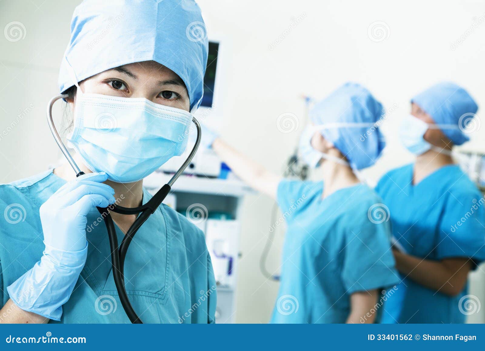 Team of Surgeons in the Operating Room, Female Surgeon Holding ...