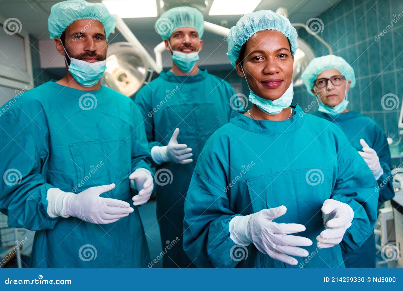Team Of Surgeons In The Operating Room Preparing For Surgery Stock