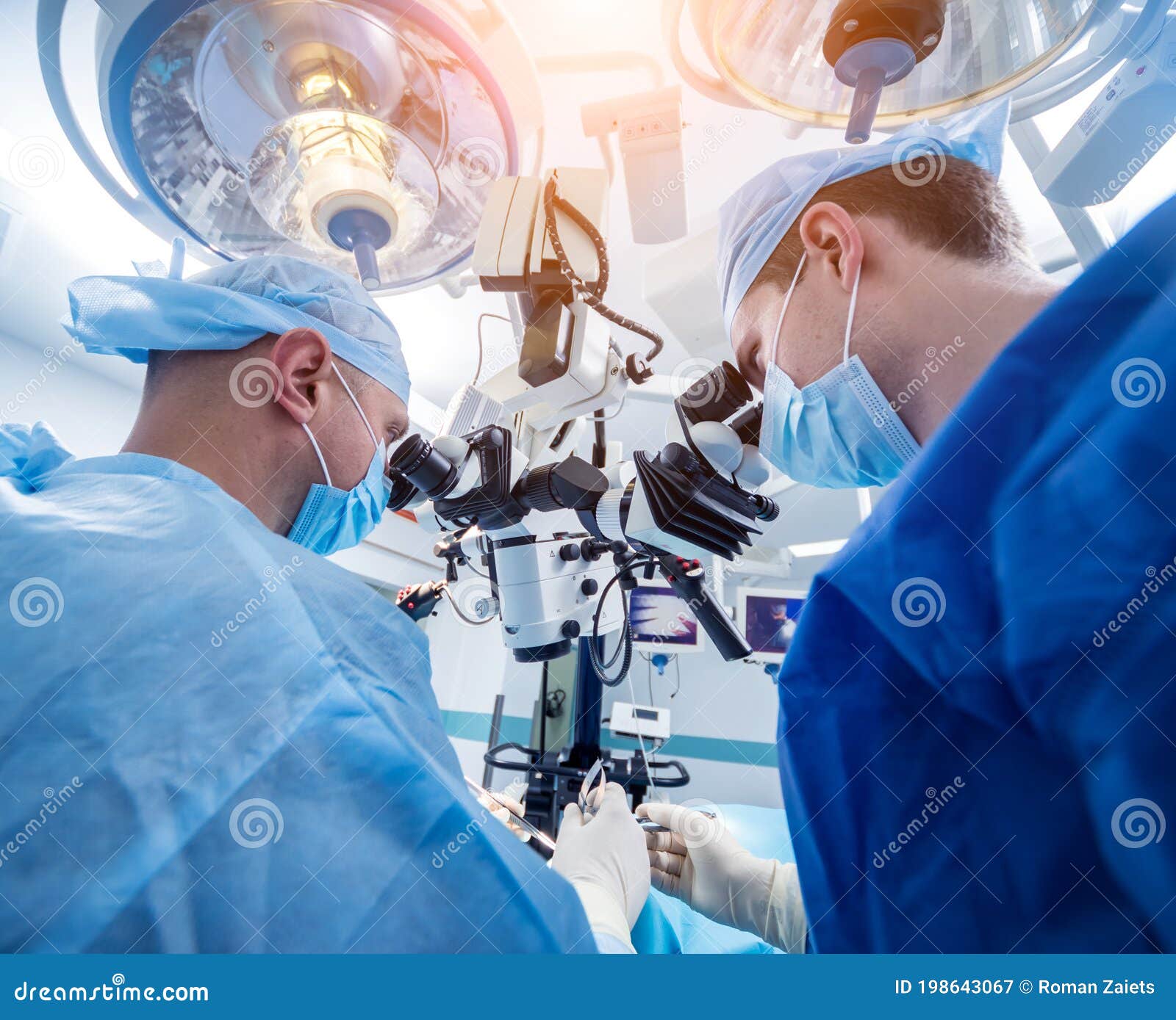 A Team of Surgeons Performing Brain Surgery To Remove a Tumor. Stock ...
