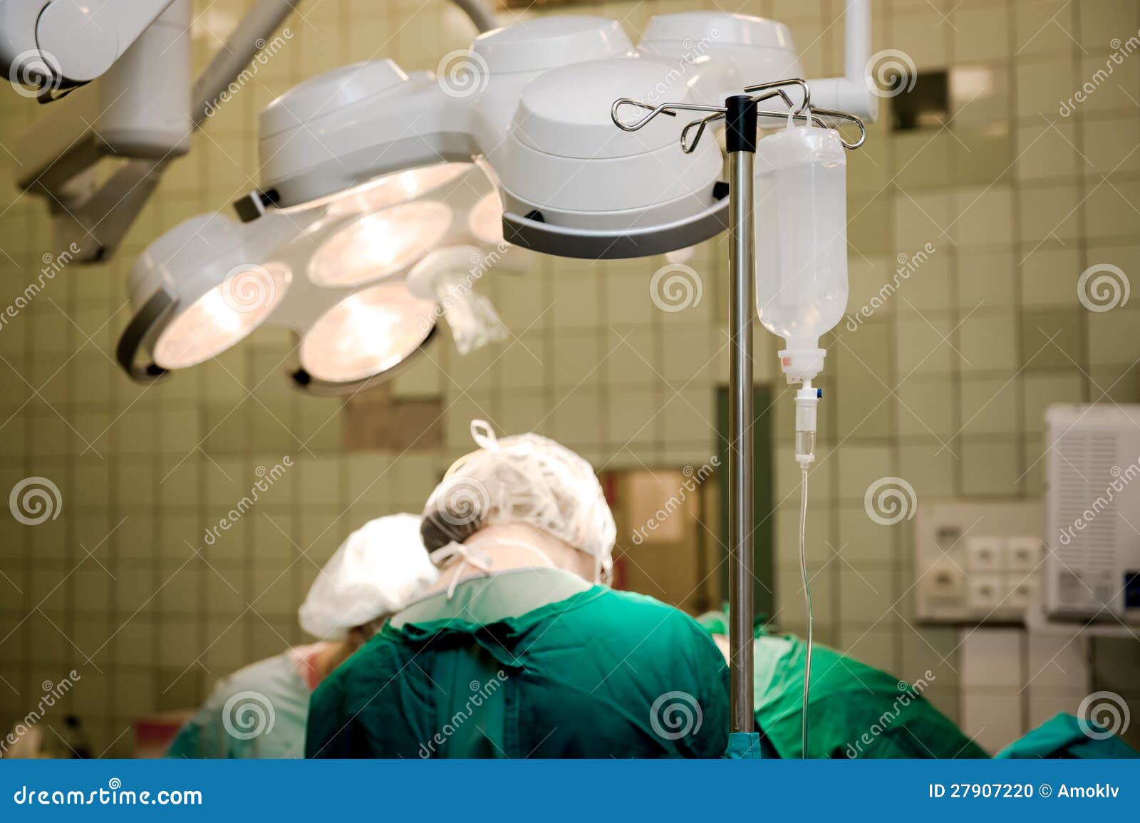 Team of surgeons at work stock photo. Image of examining - 27907220