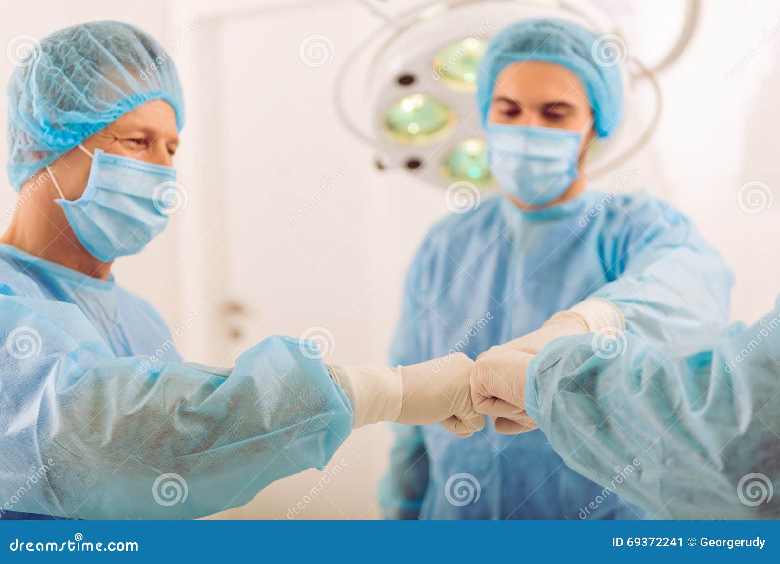 Team surgeons at work stock image. Image of equipment - 69372241