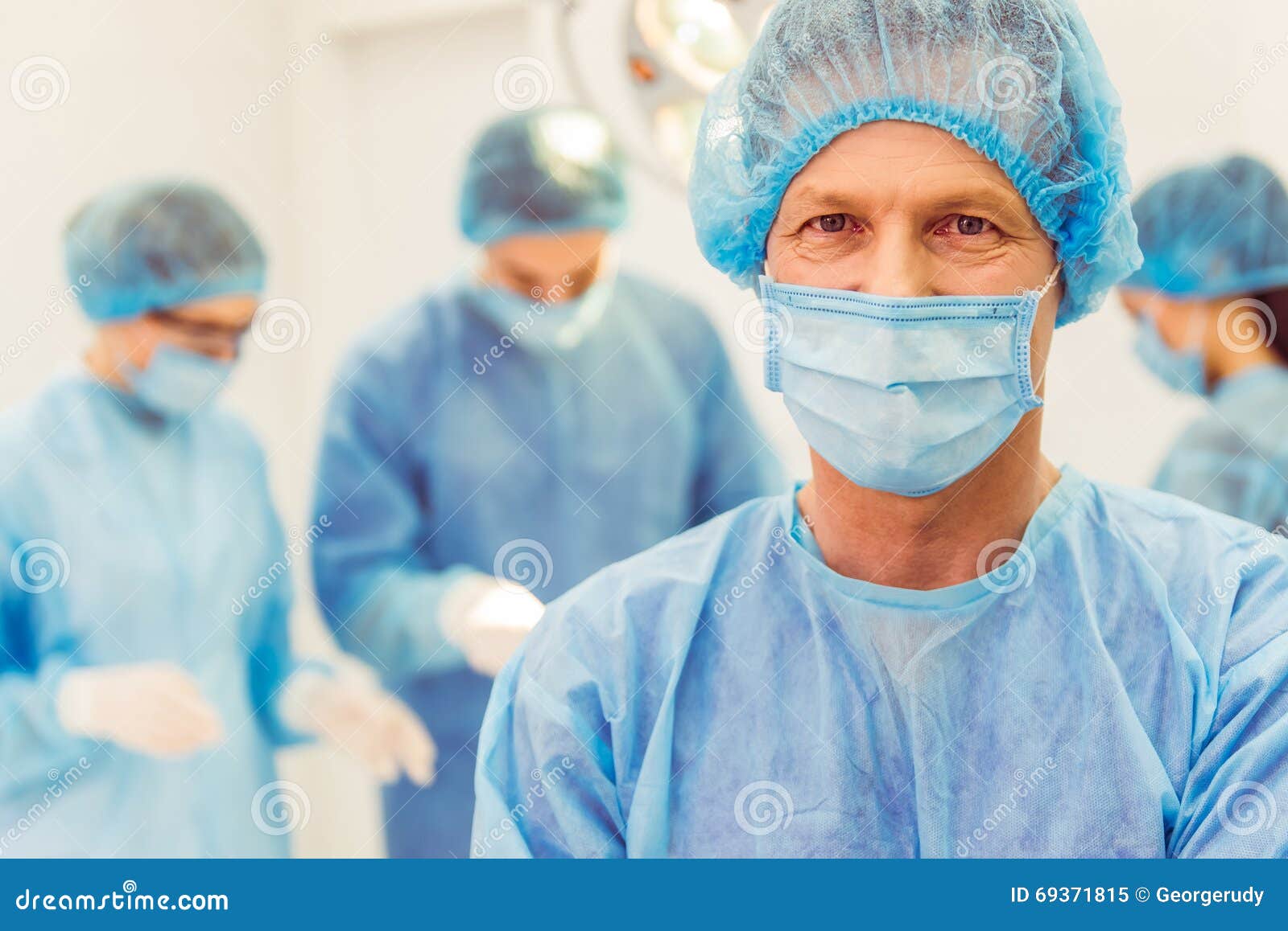 Team surgeons at work stock image. Image of mask, professional - 69371815