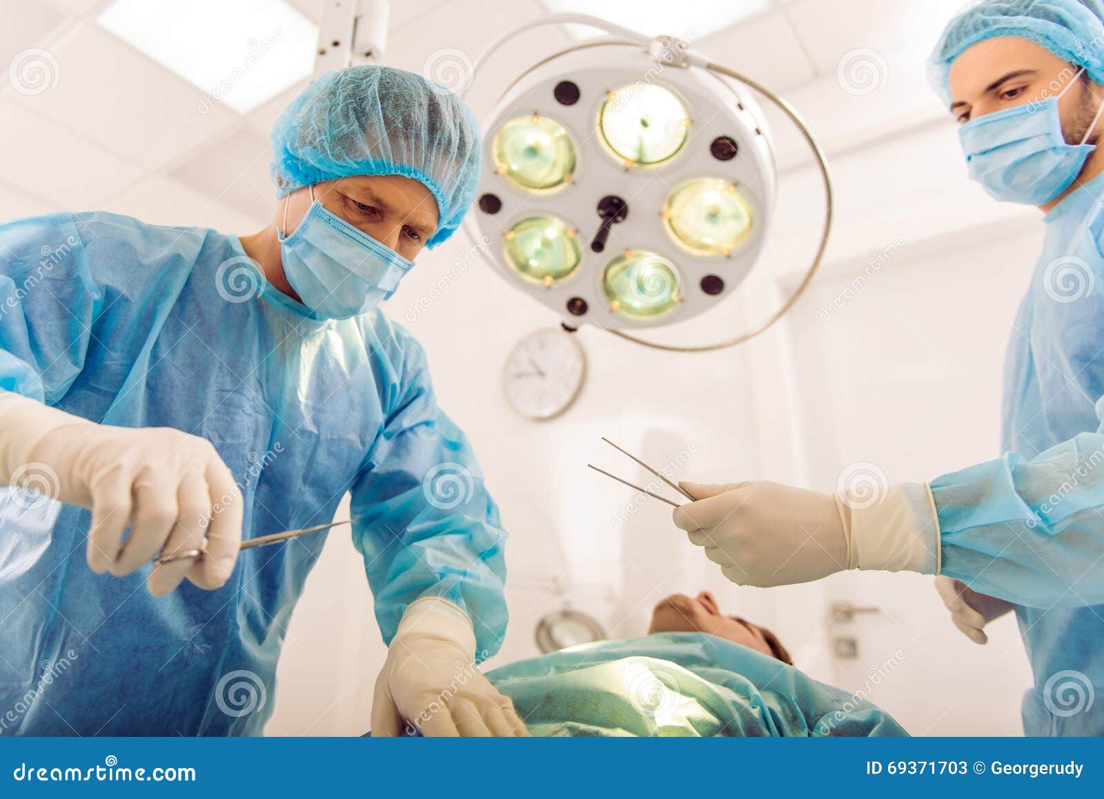 Team surgeons at work stock image. Image of aged, expression - 69371703