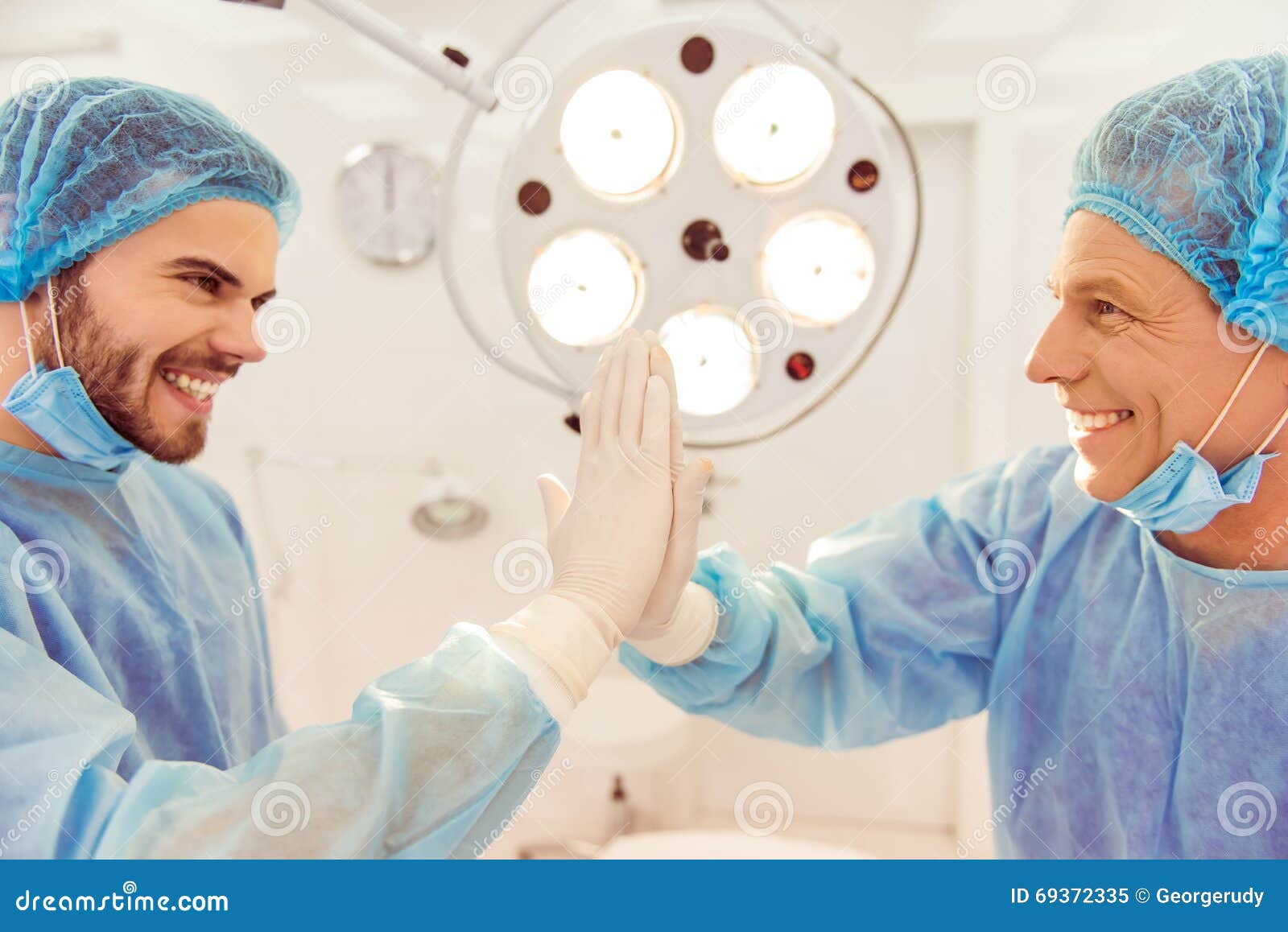 Team surgeons at work stock image. Image of five, expression - 69372335