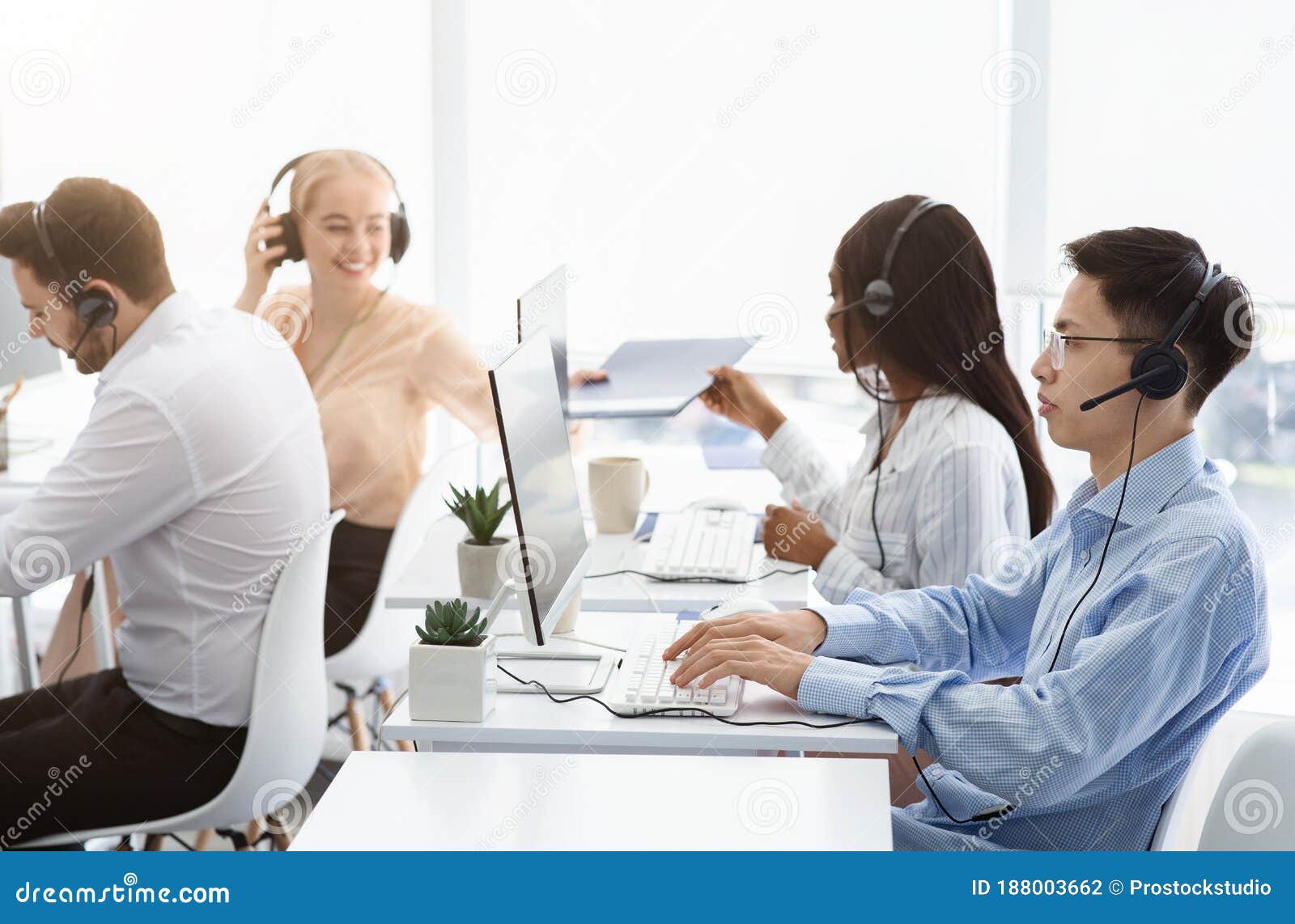 Team of Technical Support Agents Working on Hotline at Call Center ...