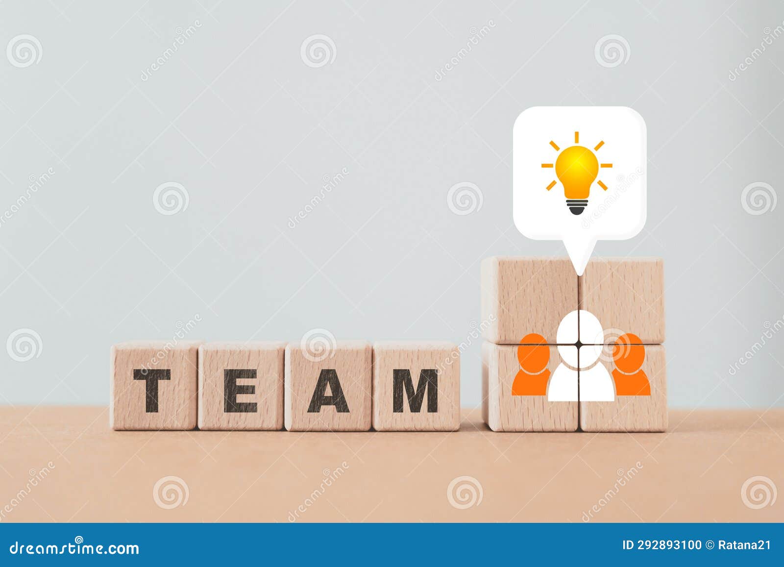 TEAM Word on Wooden Cube Blocks and Speech Bubble with Lightbulb Inside ...