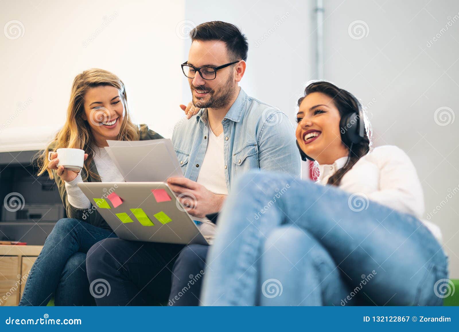 Team of Three Happily Working Together on Their Ideas Stock Image ...