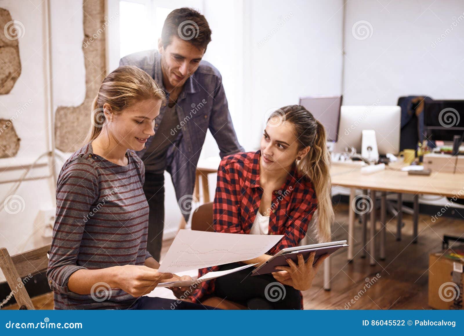 Team of Three Happy Young Professionals Stock Photo - Image of ...