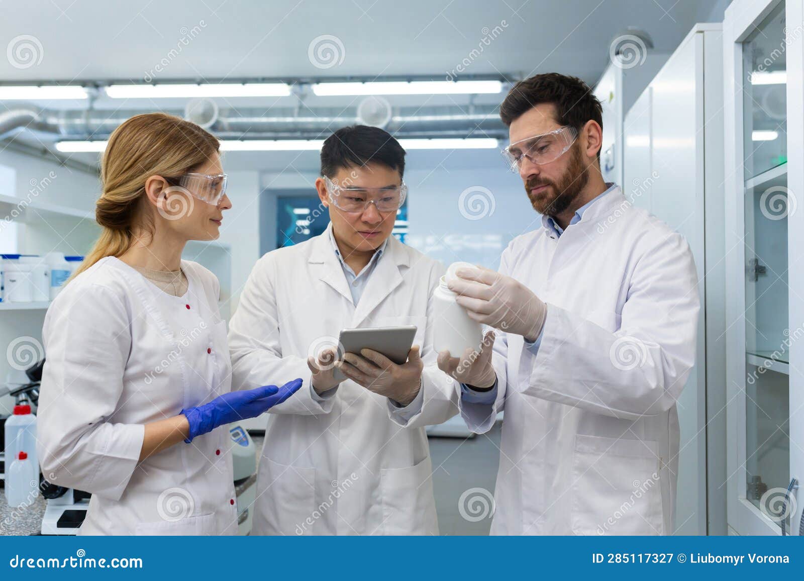 A Team of Three People, Doctors, Laboratory Workers, Scientists are ...