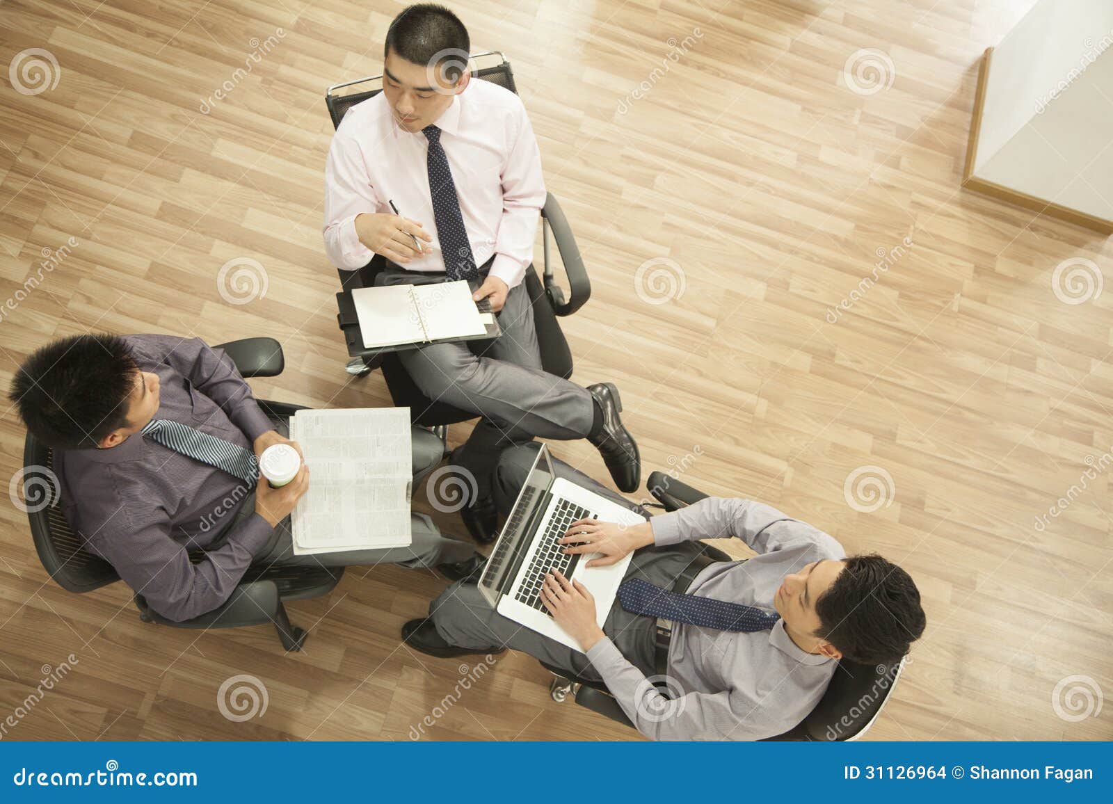 Team of Three People Working on the Project and Sitting in a Circle ...