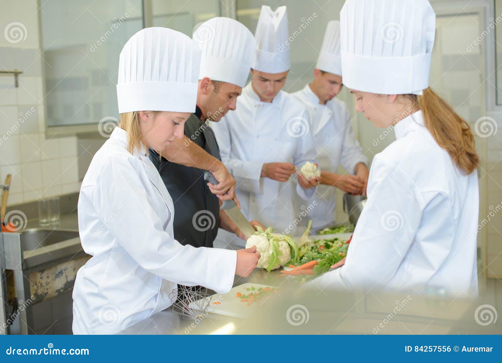 Team Trainee Chefs Preparing Vegetables Stock Photo - Image of ...