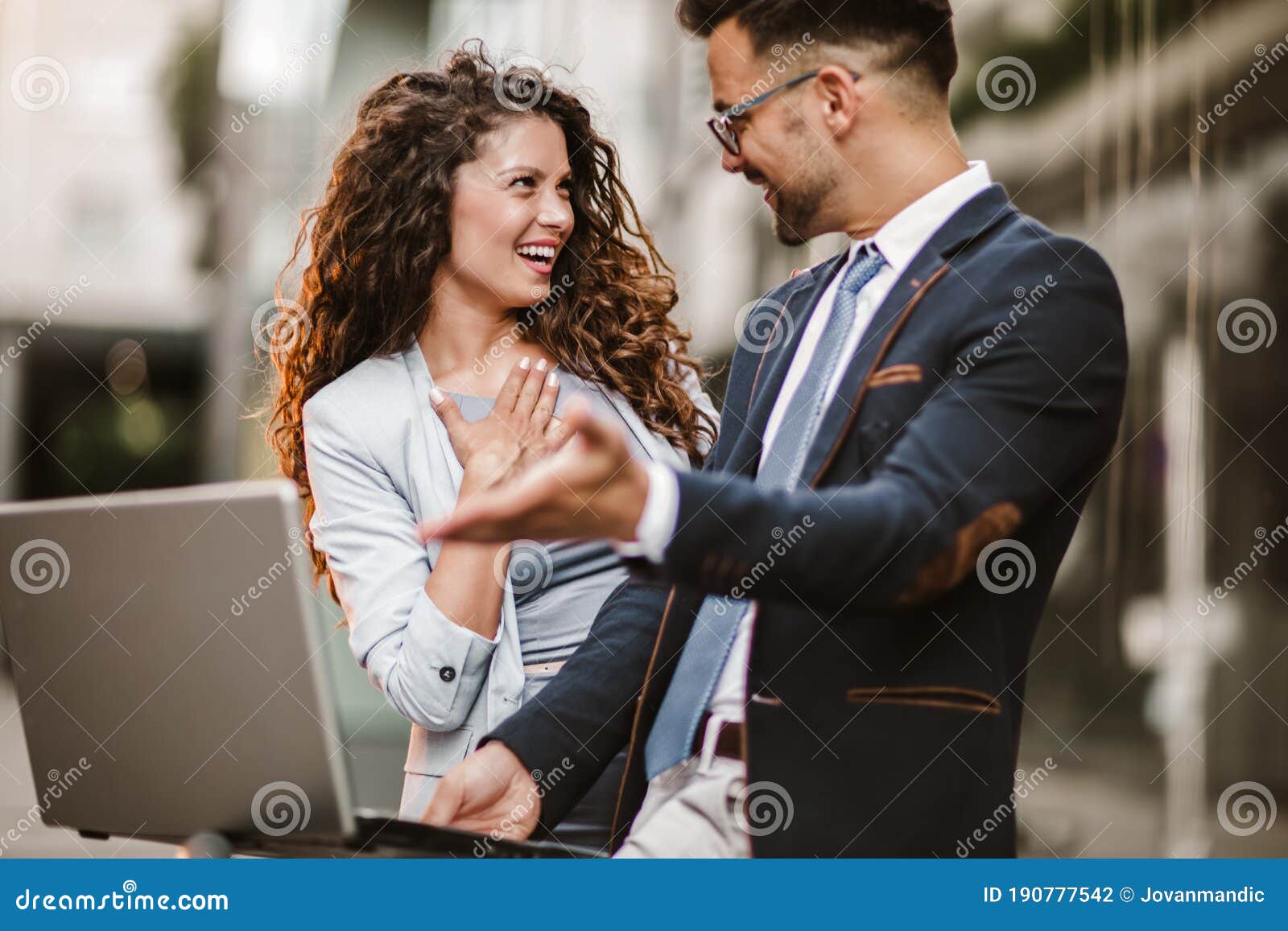 Two Business People Working Together Outdoors Using Laptop Stock Photo ...