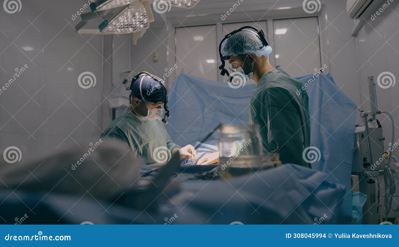 Team of Two Doctors Men Surgeons Processing Surgical Operation Using ...