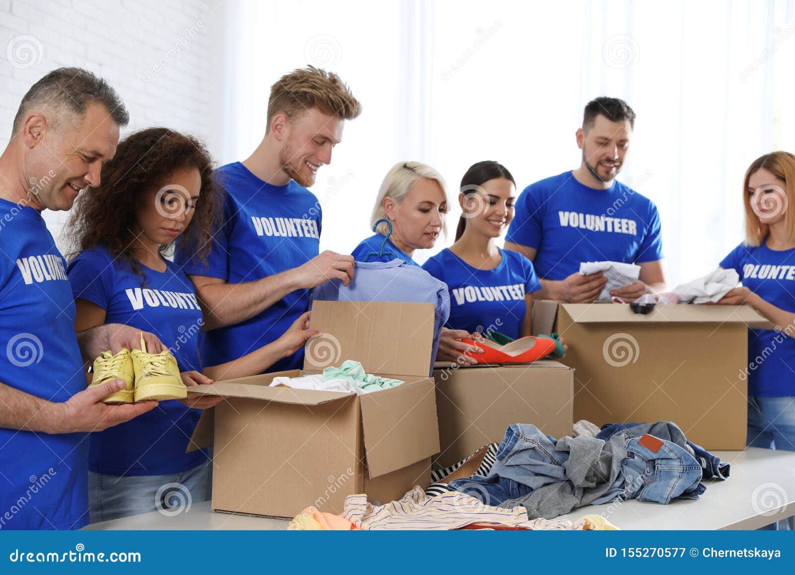 Team of Volunteers Collecting Donations in Boxes Stock Image - Image of ...