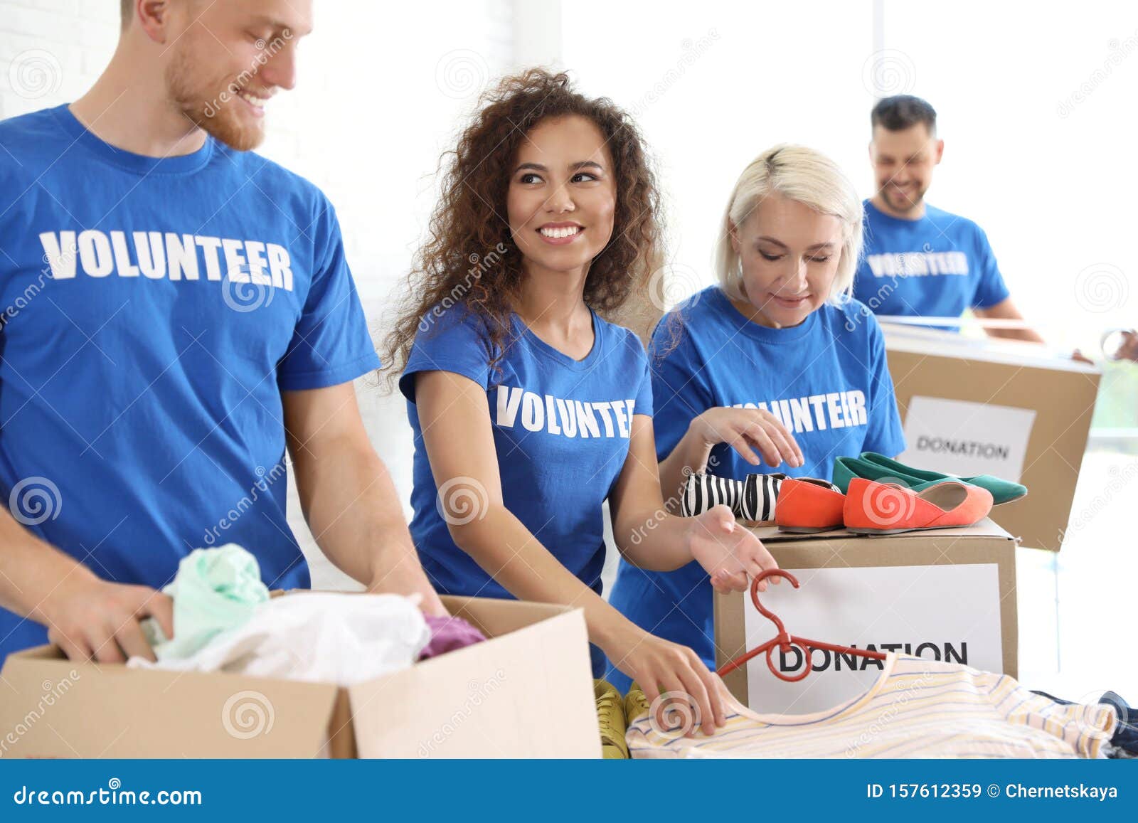Team of Volunteers Collecting Donations in Boxes Stock Image - Image of ...