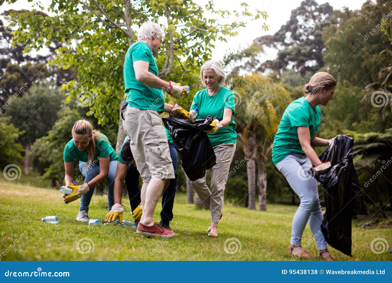 Team of Volunteers Picking Up Litter Stock Photo - Image of male ...