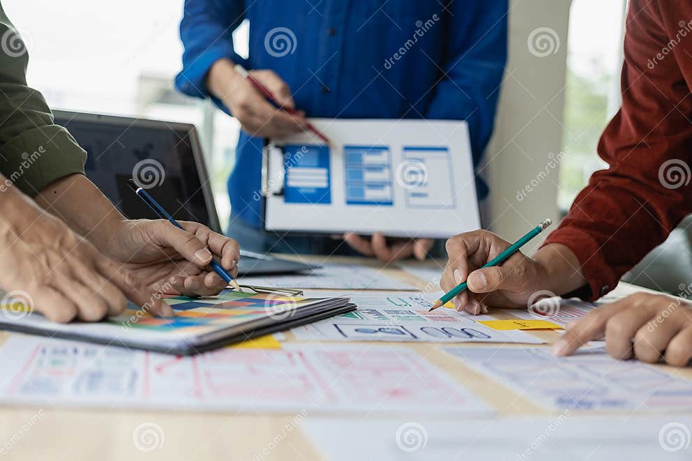 A Team of Web Designers with the Ux Ui System are Writing Programs and ...