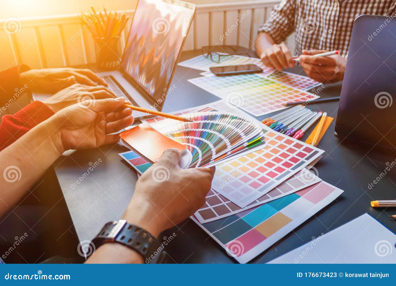 A Team of Web Designers are Working Together To Develop a Mobile ...