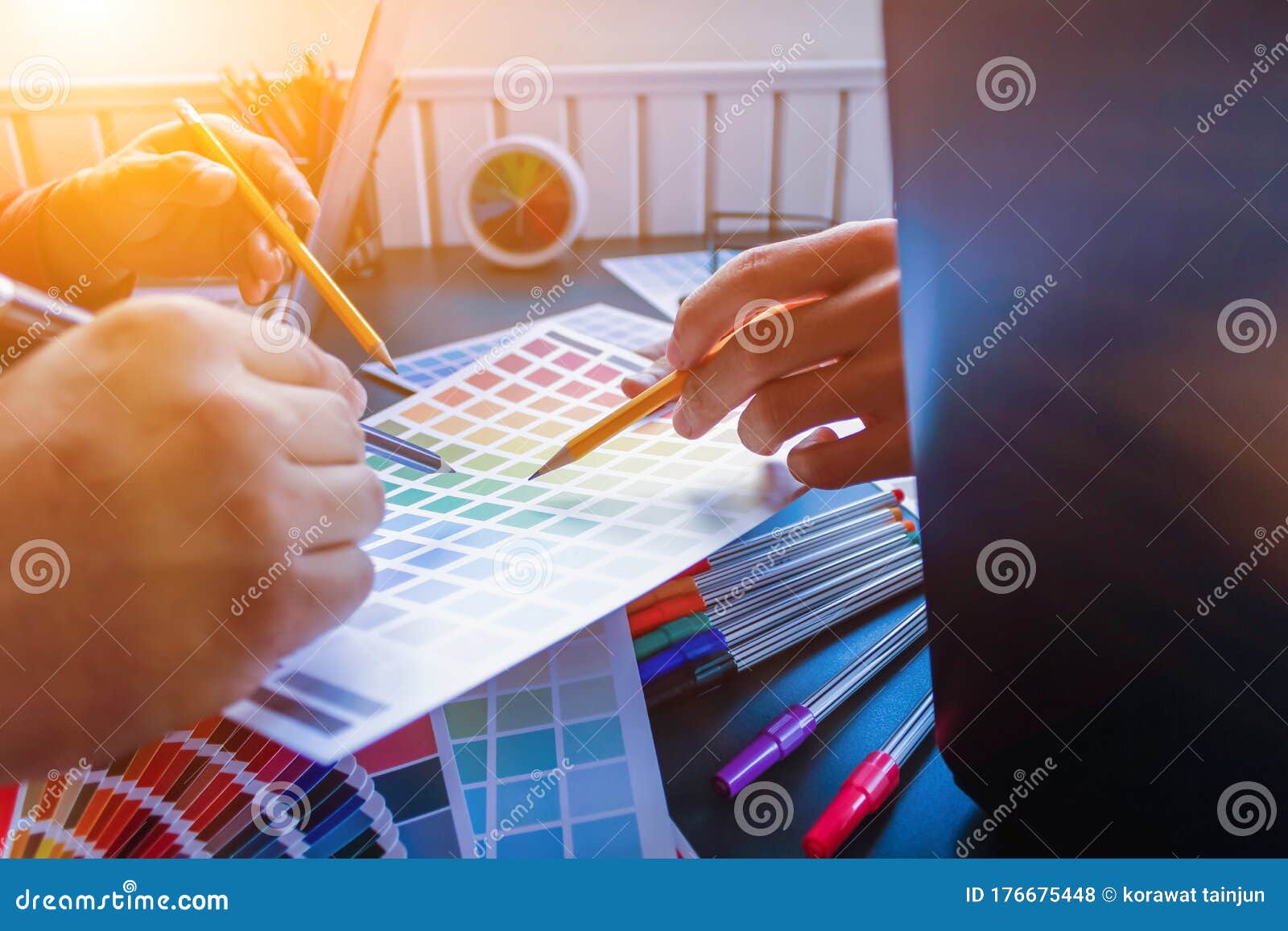 A Team of Web Designers are Working Together To Develop a Mobile ...