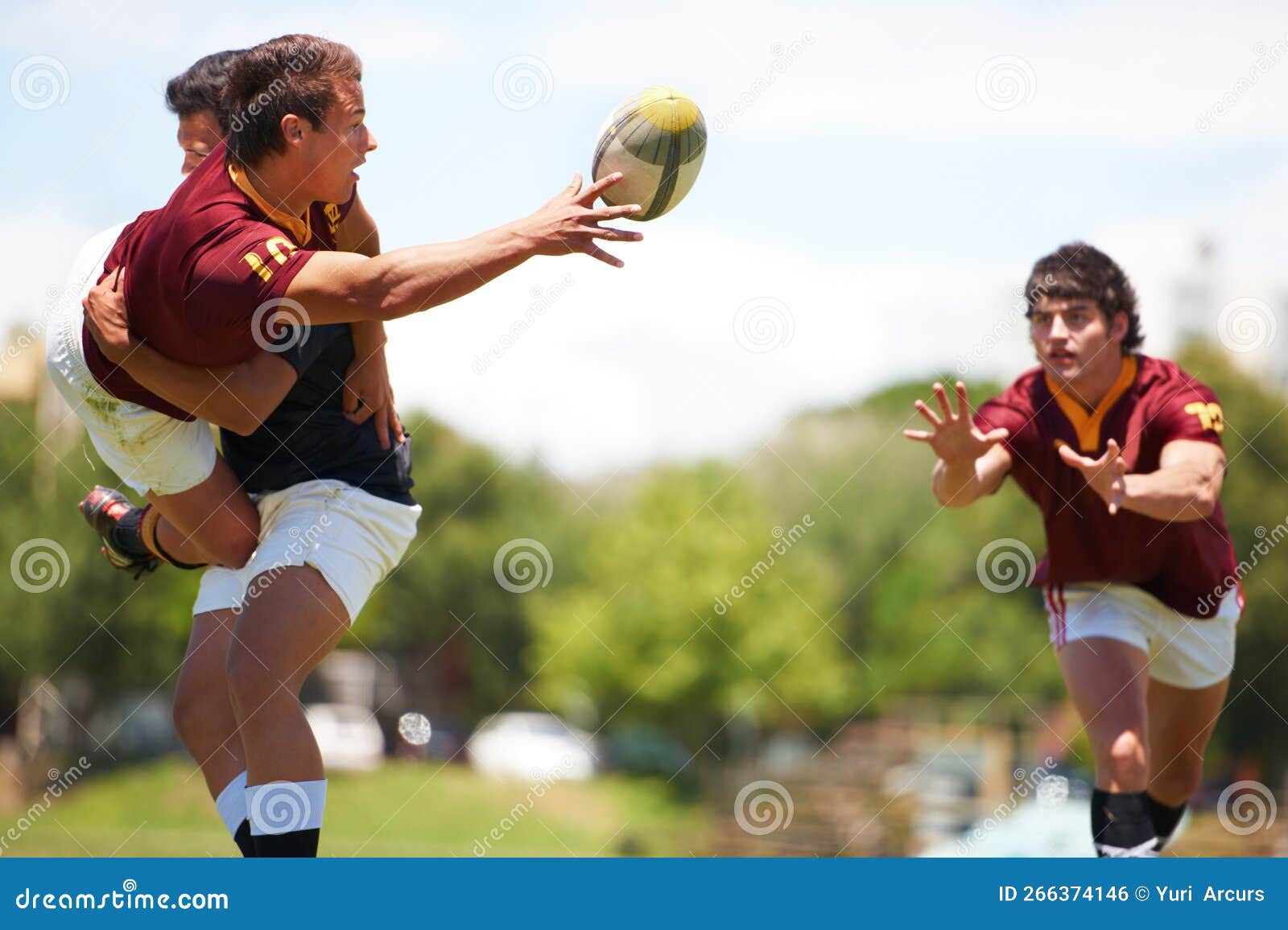 Team Work is Important To Win. a Young Rugby Player Executing a Pass ...
