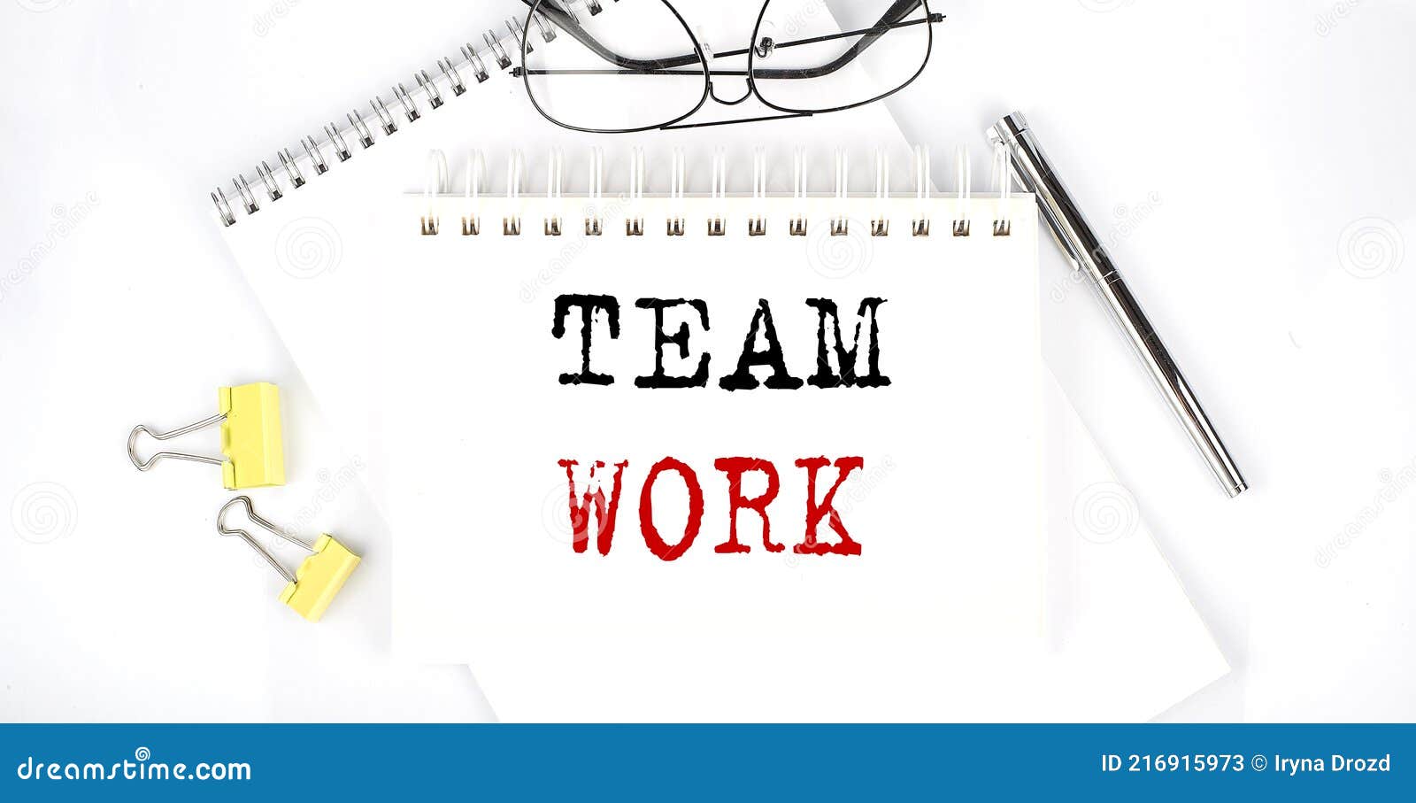 TEAM WORK Text on the Notebook with Pen,clips and Glasses Stock Image ...