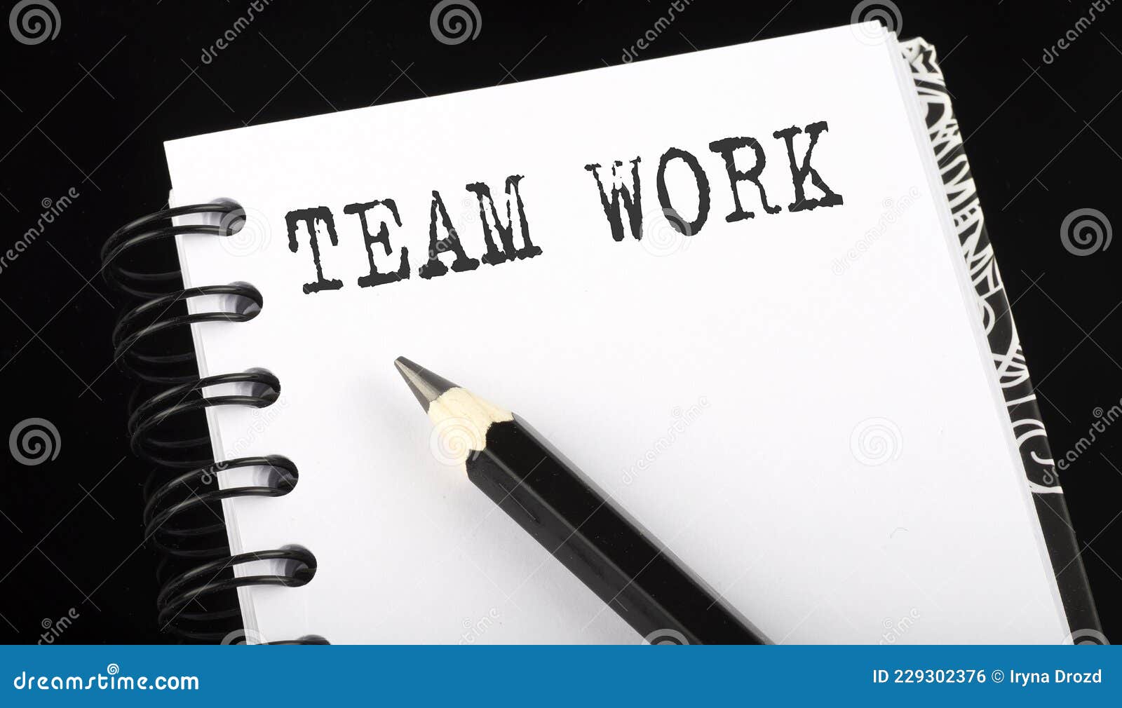 TEAM WORK Written Text in Small Notebook on a Black Background Stock ...