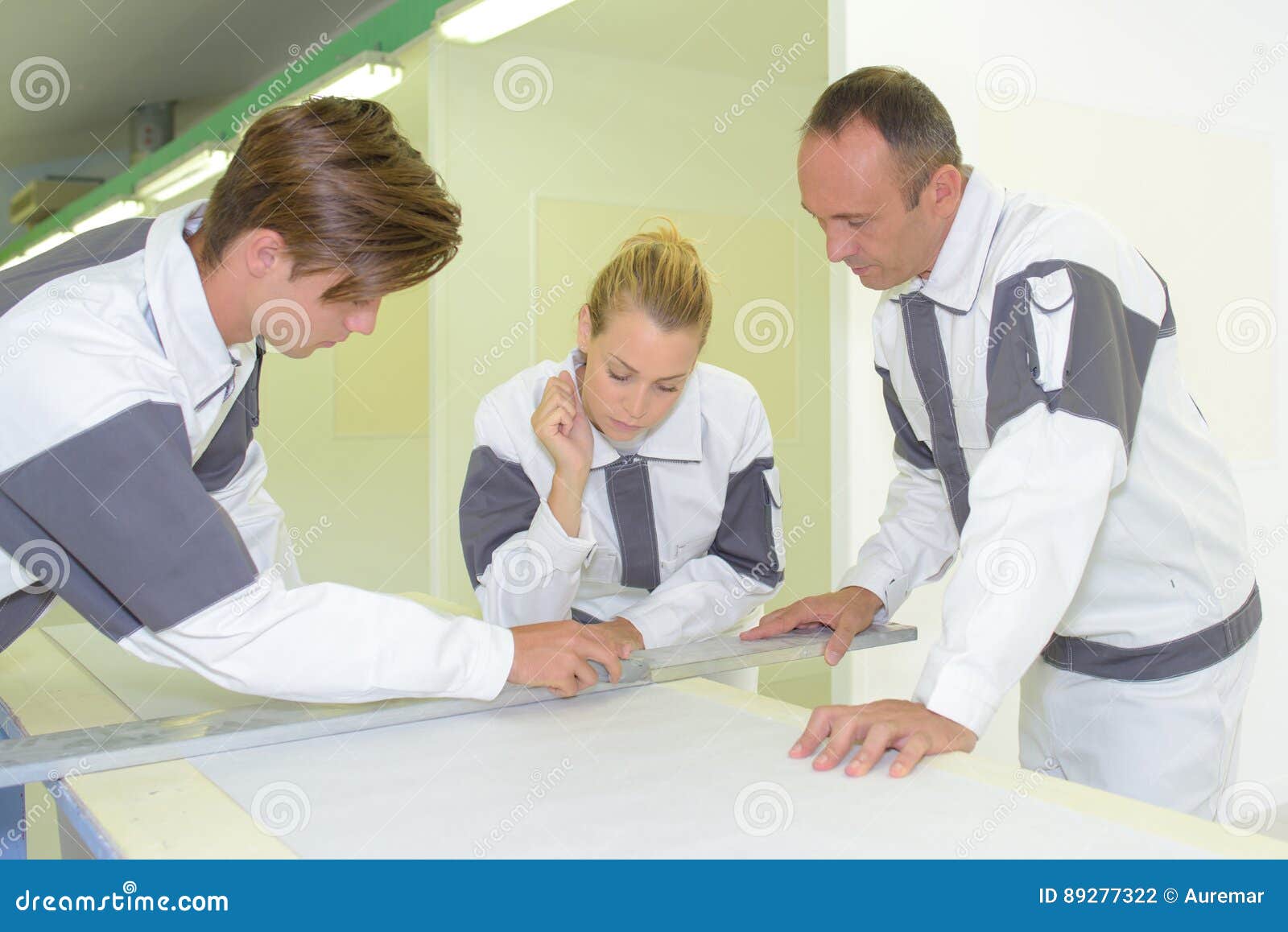 Team Workers Around Drawing Board Stock Photo - Image of measure ...
