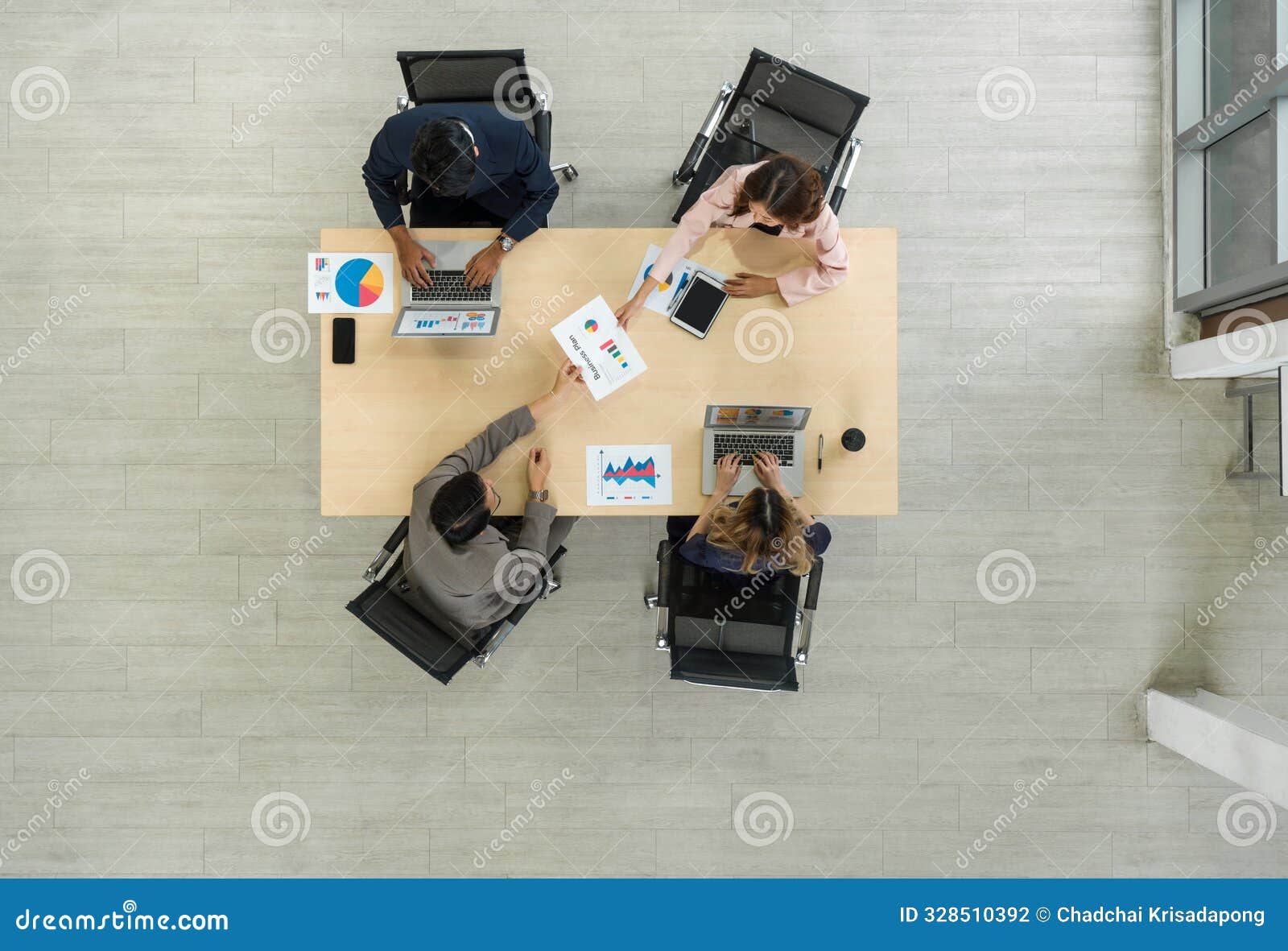 A Team of Workers is Seated Together at a Big Table in an Office ...
