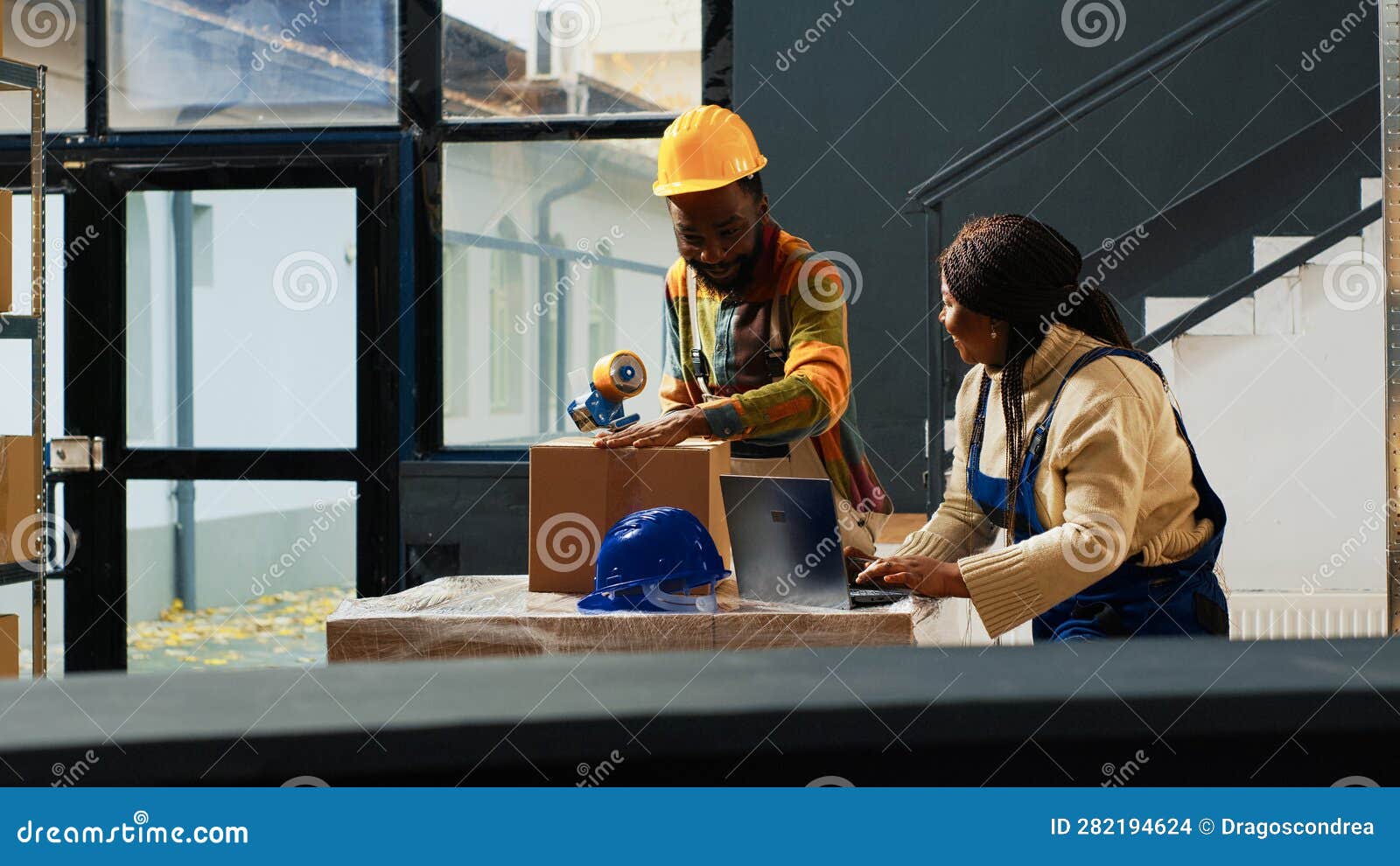 Team of Workers Using Racks and Shelves To Stack Boxes Stock Photo ...