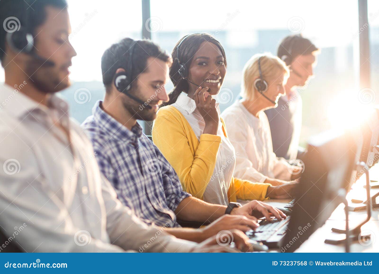 Team Working on Computer with Headset Stock Photo - Image of ...
