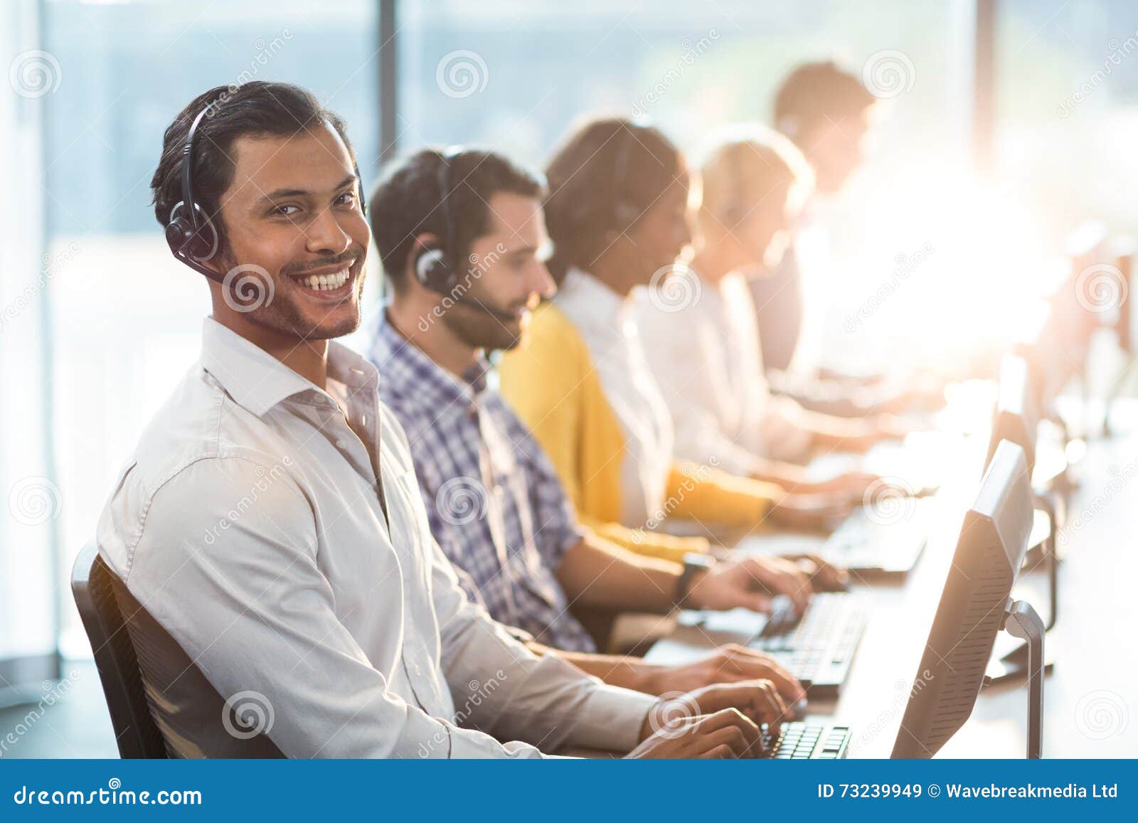 Team Working on Computer with Headset Stock Image - Image of expertise ...