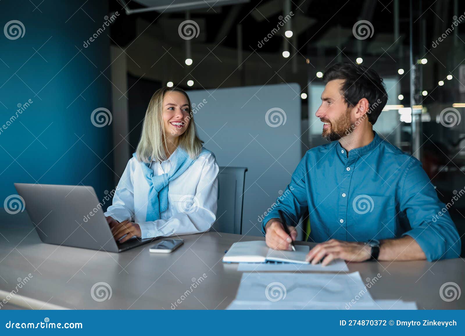 Team Working on Project Materials and Looking Excited Stock Photo ...
