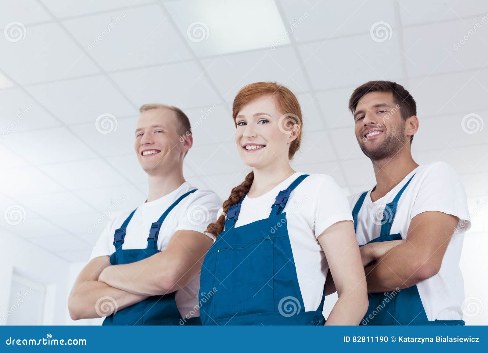Team of young cleaners stock photo. Image of indoors - 82811190