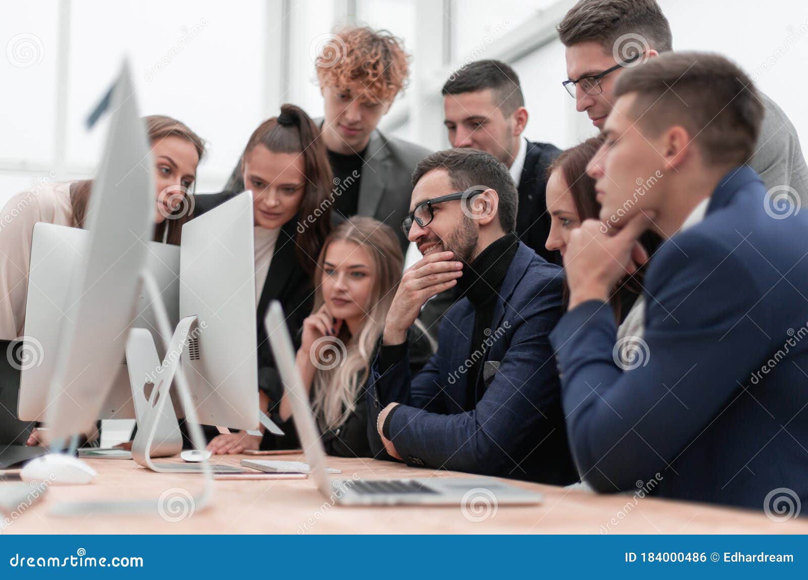 Team of Young Employees Looking Together at a Computer Screen. Stock ...