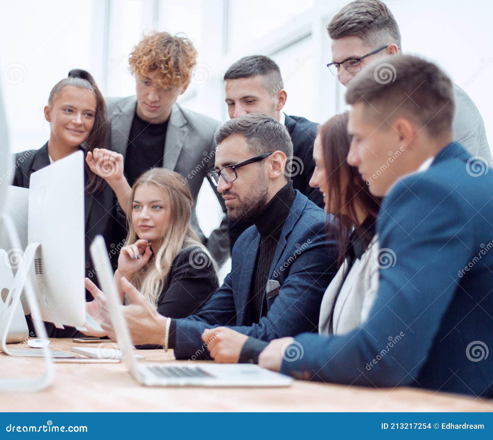 Team of Young Employees Looking Together at a Computer Screen. Stock ...