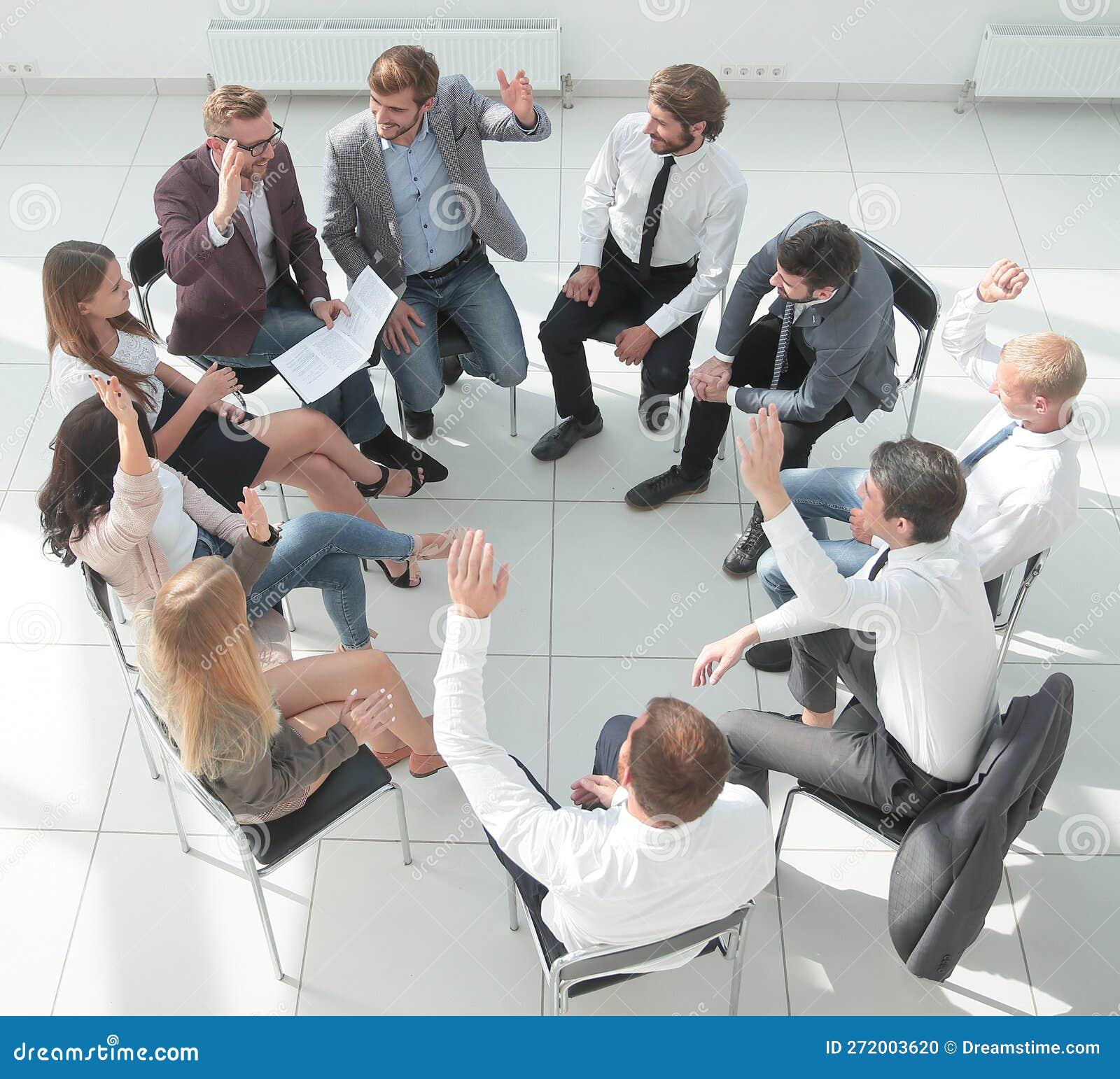 Team of Young Employees Sitting in a Circle in the Conference Room ...